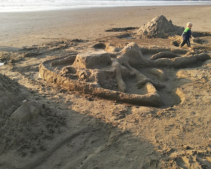 Childhood joy distilled: where imagination transforms sand into castles and ordinary afternoons into adventures.