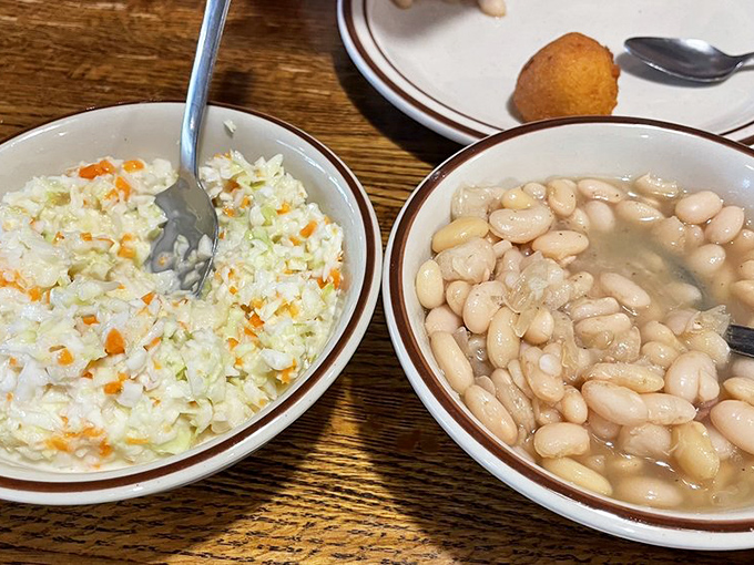 The yin and yang of Southern sides: creamy coleslaw meets humble beans. Together they create the perfect backdrop for whatever fried delight takes center stage.