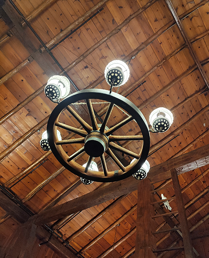 Look up to appreciate the architectural wonder of wagon wheel chandeliers against wooden beams. Rural elegance that Instagram filters can't improve upon.
