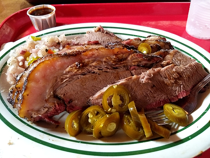 Brisket sliced so perfectly it could make a Texas pitmaster shed a tear of joy. Those pickled jalape&ntilde;os add just the right kick.