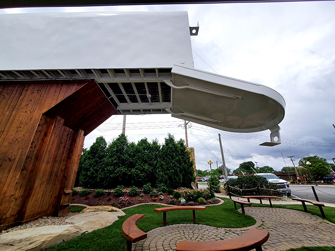 Curved benches surround the mailbox's base, inviting visitors to sit and contemplate what Amazon package could possibly require this much delivery space.
