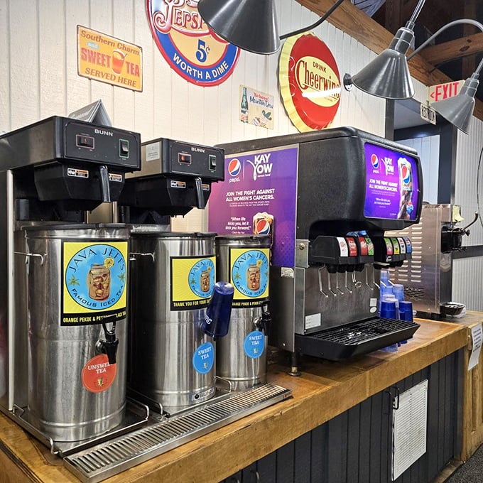 Sweet tea dispensers standing at attention like sentinels guarding liquid Southern gold. The elixir that makes 95-degree days bearable and conversations sweeter.