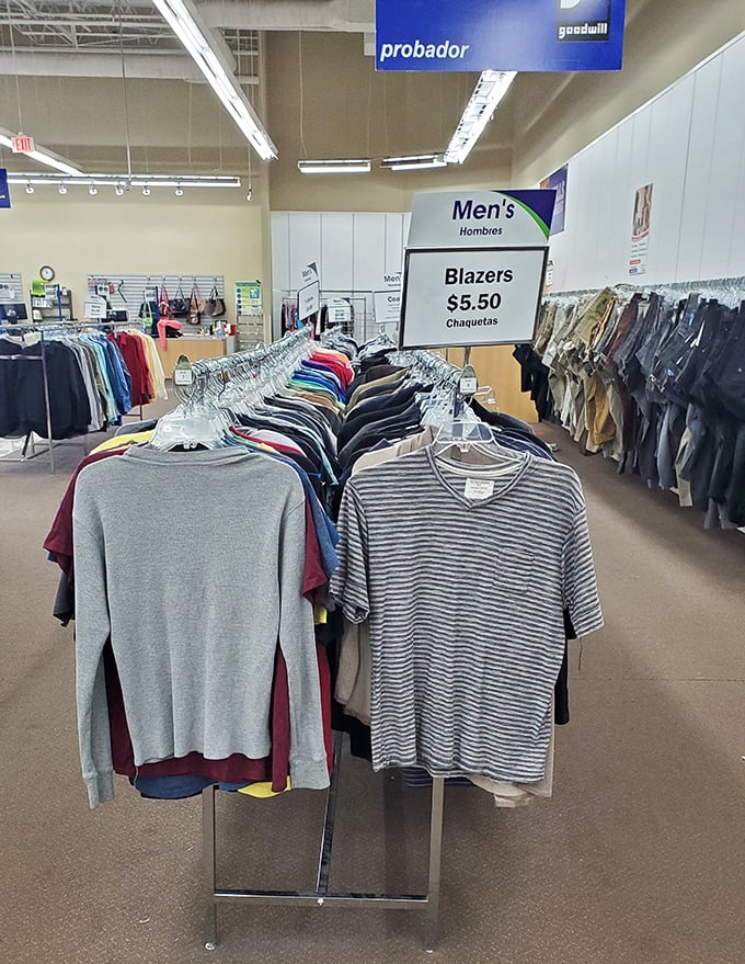 Men's blazers hang like a row of affordable opportunities to look sharp without emptying your retirement fund.