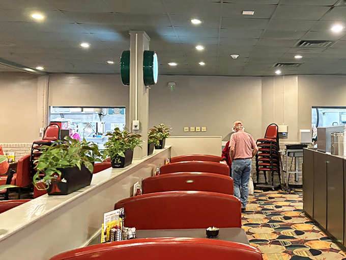 Counter seating offers front-row views of the action while booths provide cozy corners for lingering conversations.