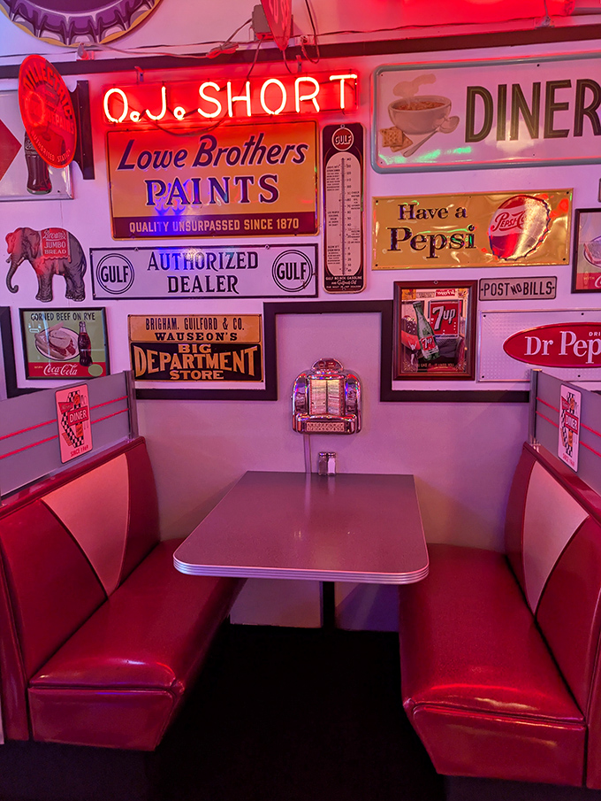 The quintessential diner booth &ndash; where red vinyl meets vintage advertising in a corner that's hosted everything from first dates to business deals to family celebrations.