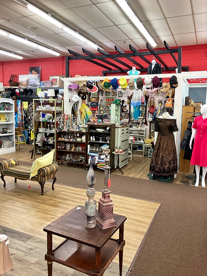 Vintage clothing and accessories arranged like a department store from another era. That hat collection could star in its own period drama.