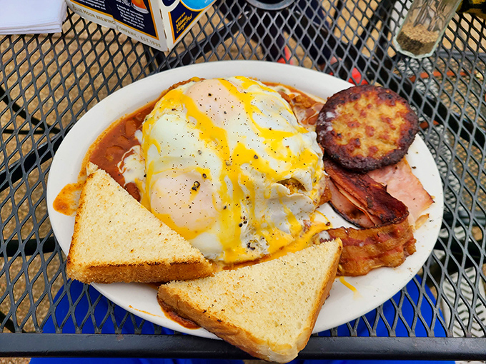 Breakfast that doesn't whisper "good morning" but belts it out with sunny-side-up enthusiasm, where eggs, meat, and toast form the holy trinity of day-starters.