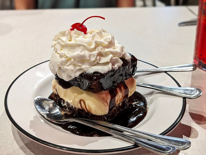A brownie sundae that makes time stop &ndash; hot fudge cascading down vanilla ice cream like chocolate lava, crowned with clouds of whipped cream.