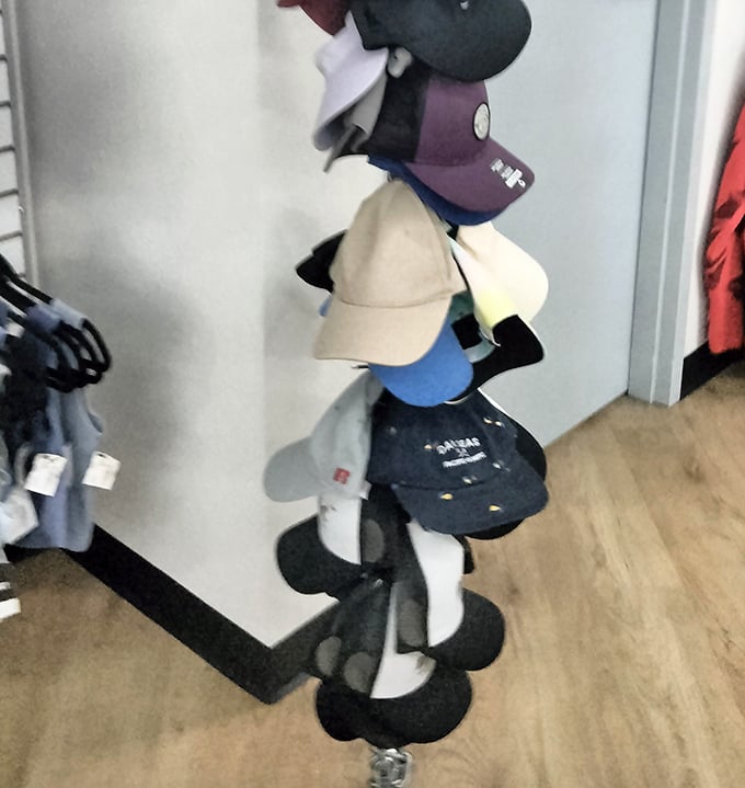 This cap collection could solve bad hair days for an entire Oklahoma county&mdash;stacked like a fashionable game of Jenga.