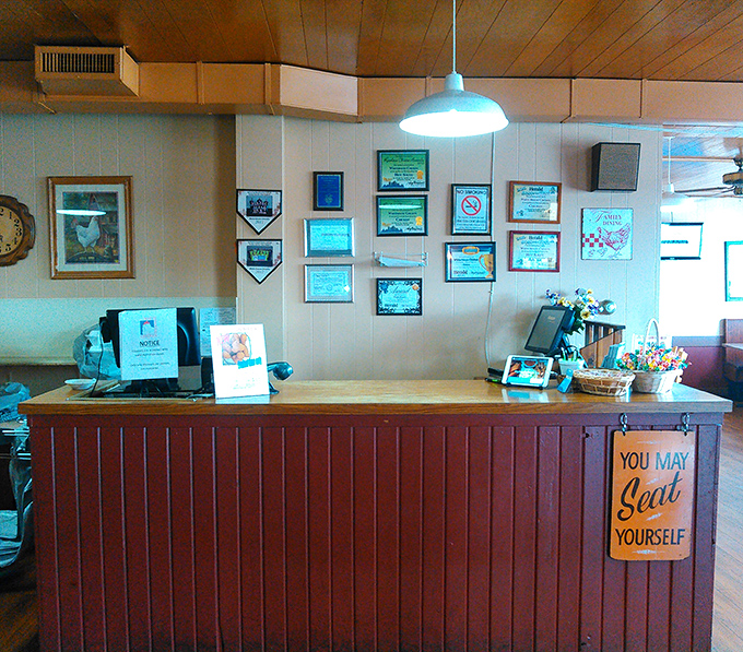 The order counter where magic begins, complete with a sign that perfectly captures the restaurant's unpretentious charm: "You May Seat Yourself."