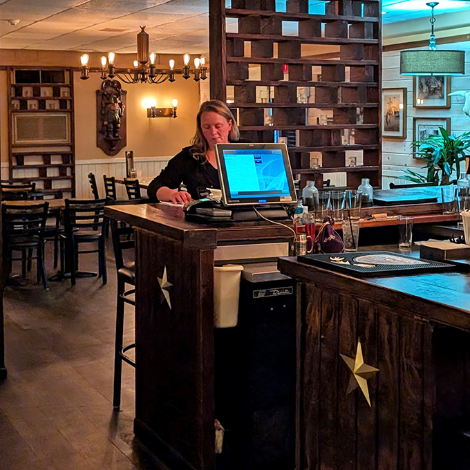 The host station features the restaurant's signature star motif, where friendly staff orchestrate the dining experience with practiced efficiency.