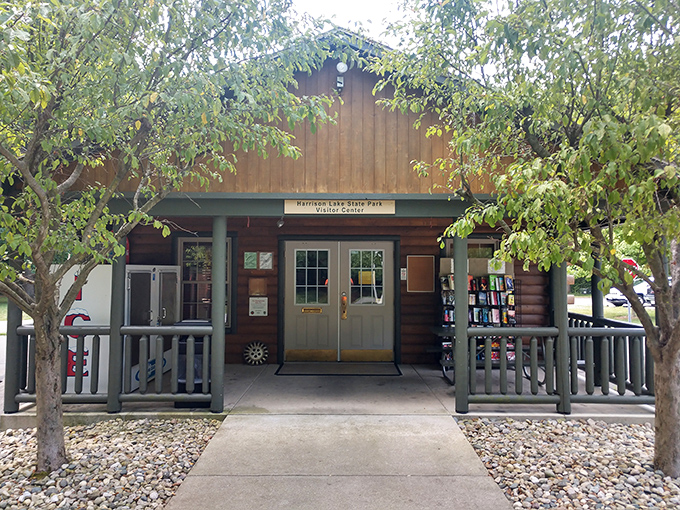 The visitor center welcomes explorers with rustic charm and promises of adventures waiting just beyond its wooden doors.