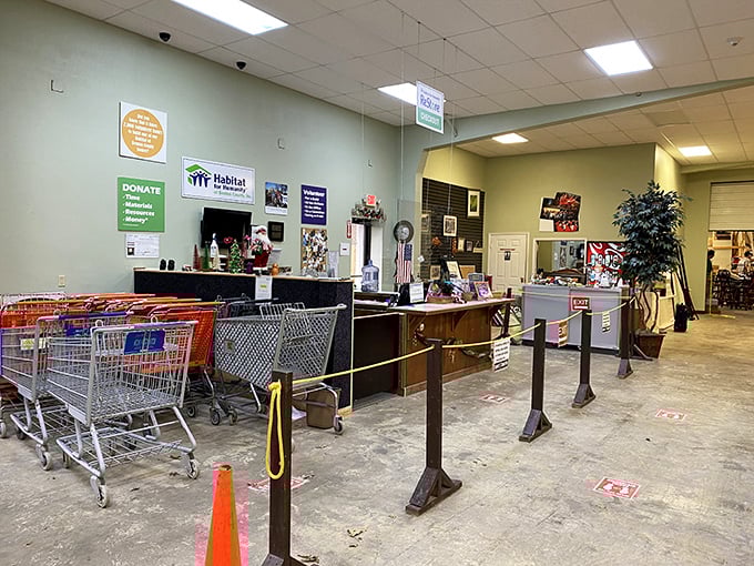 The checkout area welcomes shoppers with shopping carts ready for filling. Volunteers stand ready to help you navigate this secondhand wonderland.