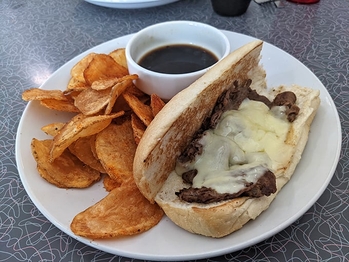 The French dip arrives with house-made chips and a side of au jus that you'll be tempted to drink straight from the cup. No judgment here.
