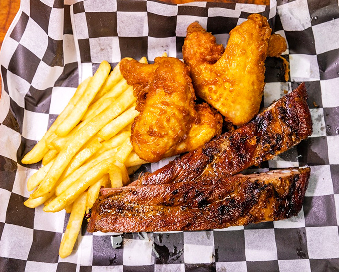 The combo platter that answers the eternal question: "Why choose between chicken and ribs when you can have both?" Checkered paper never held such treasure.