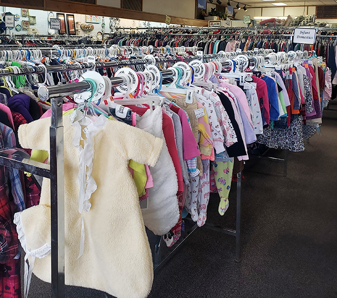 Tiny clothes for tiny humans, all waiting for their second act. That sherpa onesie has barely seen a playground before landing here, ready for new adventures.
