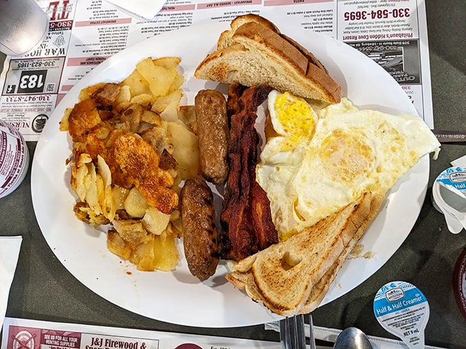 The breakfast plate that launched a thousand productive days &ndash; eggs, bacon, sausage, toast, and home fries in perfect harmony.