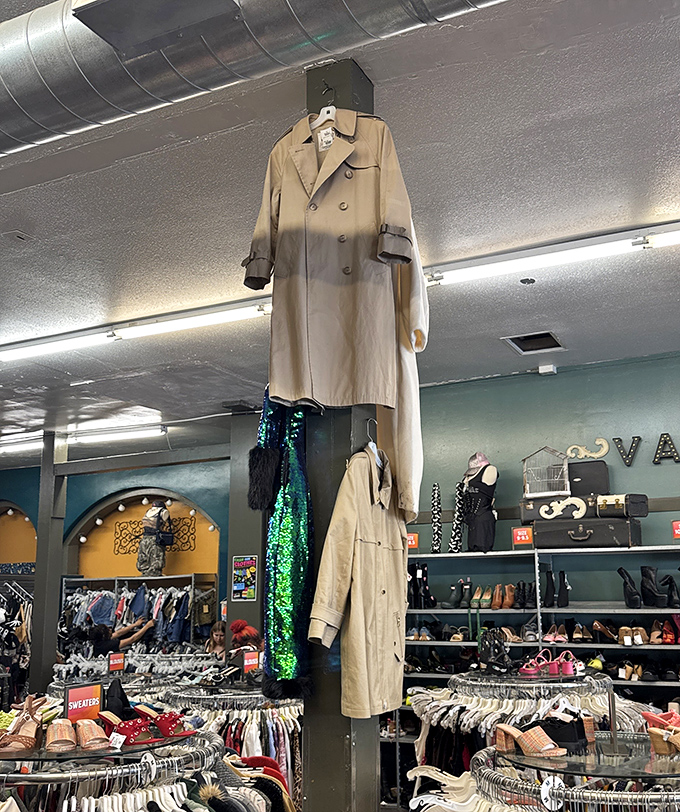 That trench coat hanging from the ceiling isn't just dramatic decor&mdash;it's a beacon signaling "serious fashion happens here" to passersby.