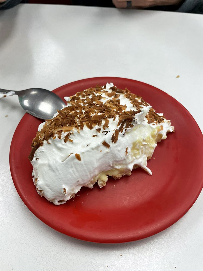 Coconut cream pie with a cloud of whipped topping and toasted coconut flakes&mdash;the dessert equivalent of finding money in an old jacket pocket.