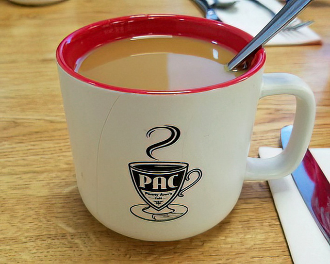 The official morning fuel of Penny Ann's—coffee served in their signature mug. Simple pleasures that remind you why diners rule breakfast.