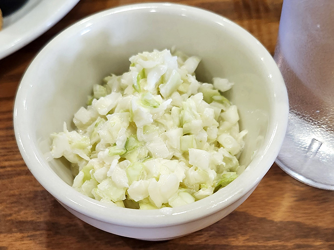 House-made coleslaw that respects the cabbage enough not to drown it&mdash;crisp, fresh, and the perfect counterpoint to all that fried goodness. 