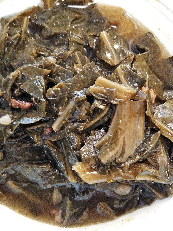 These aren't just collard greens&mdash;they're vegetables with a backstory, simmered low and slow with flavors that whisper of tradition.