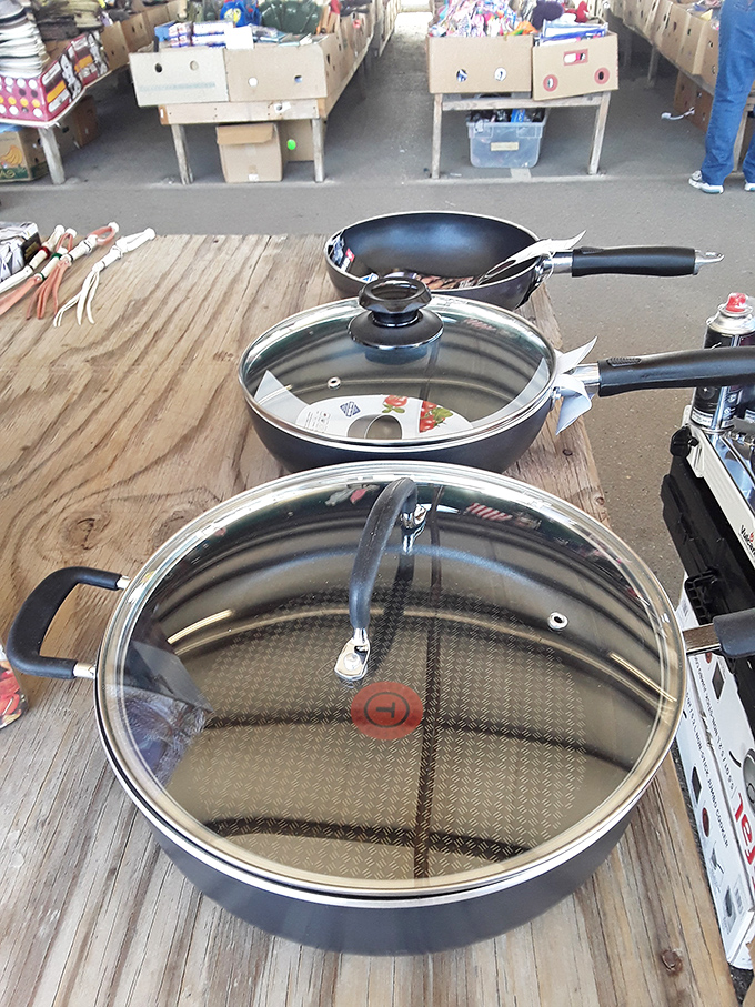 Quality cookware waiting for its next kitchen adventure. These pans have probably seen more successful meals than most cooking shows.