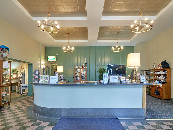 The elegant check-out counter feels more like a boutique hotel lobby than a retail space. Those chandeliers have seen some serious antiquing.