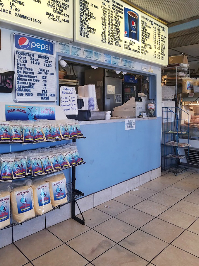 The ordering counter—where dreams come true and diets go to die. Those blue bags of fish fry seasoning hold secrets worth investigating.