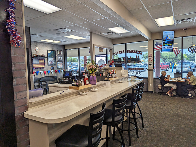 The counter seating offers front-row tickets to the breakfast show, where regulars exchange morning banter and servers move with the choreographed efficiency of Broadway dancers.