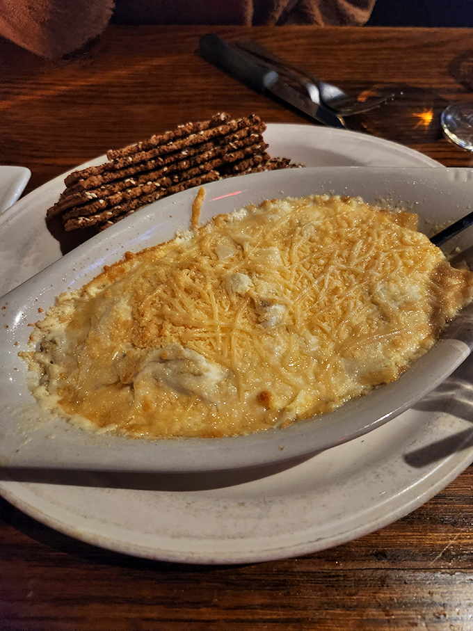 Bubbling hot crab dip with pretzel sticks standing at attention&mdash;a shareable treasure that rarely makes it to the second round of conversation.