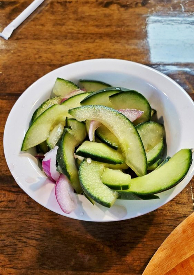 The cucumber salad—a refreshing counterpoint to rich seafood. Simple, crisp, and exactly what you need between bites of that grouper sandwich.