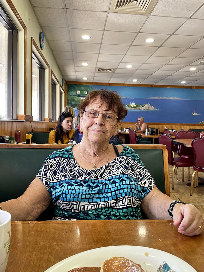 The dining room where conversations flow as freely as the coffee, and every booth holds decades of stories shared over comfort food.