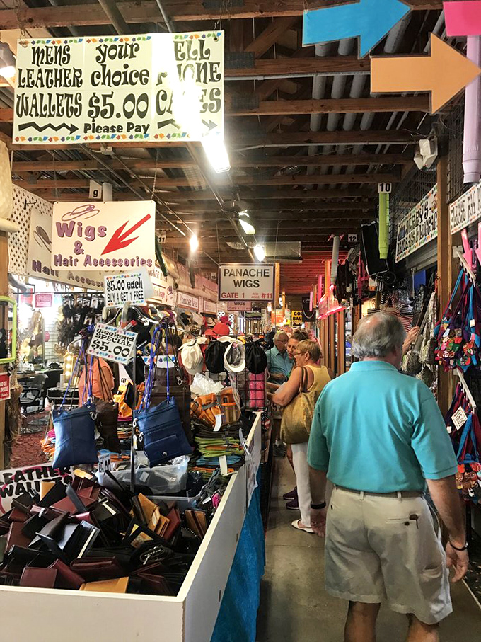 The universal flea market stance: hands clasped behind back, eyes scanning, mind calculating if that wallet is worth haggling over.