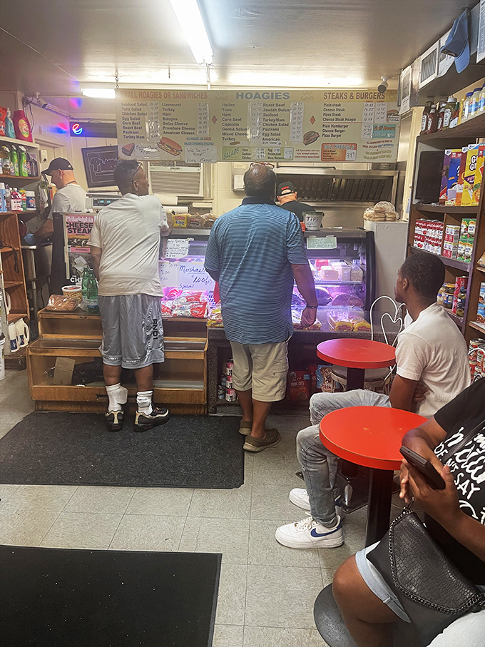 Lunchtime at Gooey Looies means a line of regulars who know exactly where to find the best cheesesteak in South Philly.