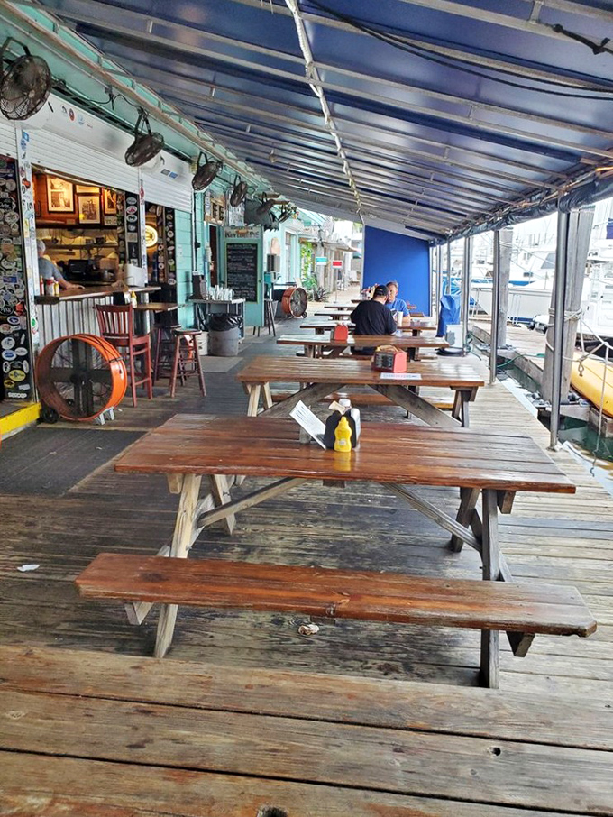The deck seating isn't fancy, but neither are the best days of your life. These tables have heard more fishing stories than most bartenders.