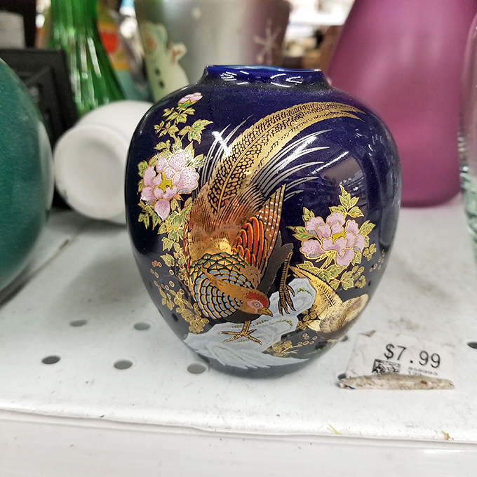 This cobalt vase with golden bird detailing screams "someone's going to think you paid way more than $7.99." Decorating gold medal.