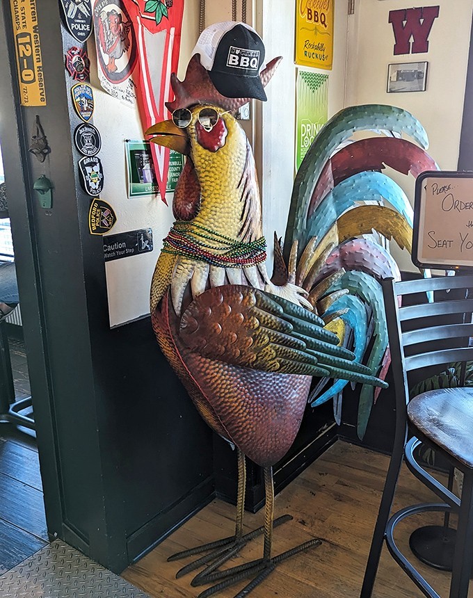 This metal rooster isn't just decoration&mdash;he's the unofficial doorman, silently judging if you're worthy of the smoked treasures that await inside.