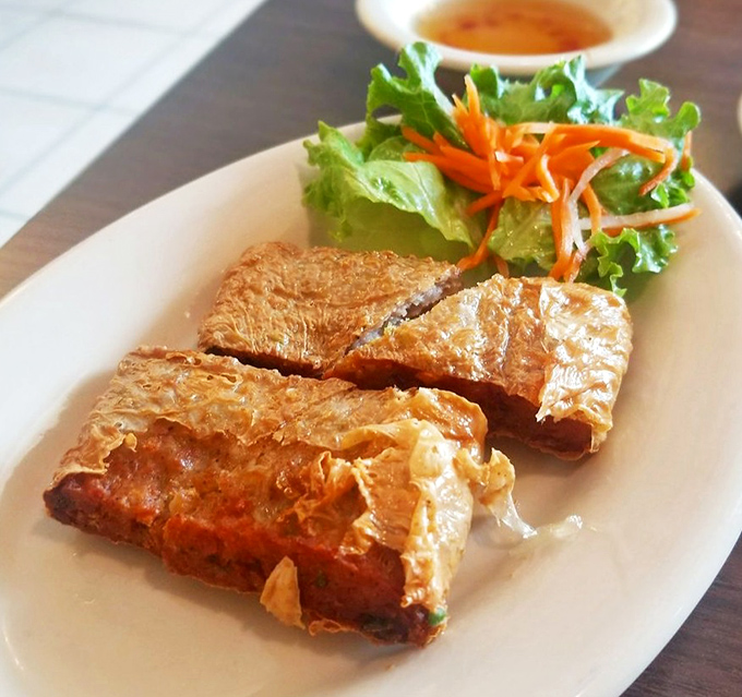 Crispy fried tofu with golden exteriors and tender centers, served with fresh greens and a sauce that makes vegetables taste downright exciting.