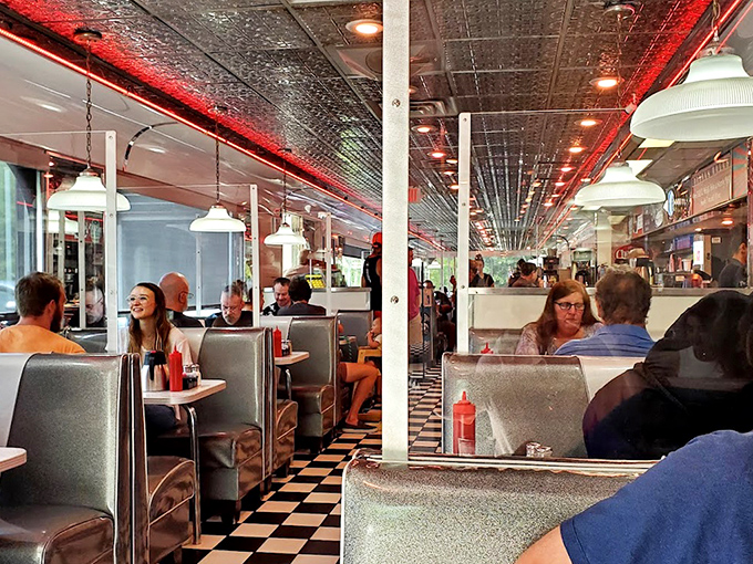 The diner's interior buzzes with conversation and clinking silverware&mdash;a symphony of satisfaction conducted by hunger.