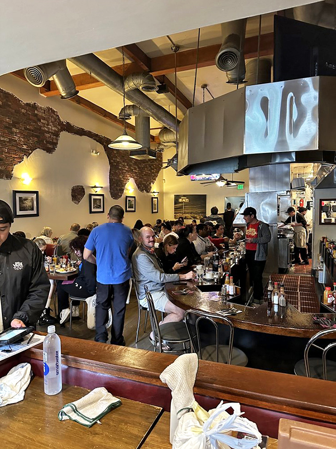 Weekend warriors line the counter, united in their quest for pancake nirvana and the shared understanding that naps will follow.