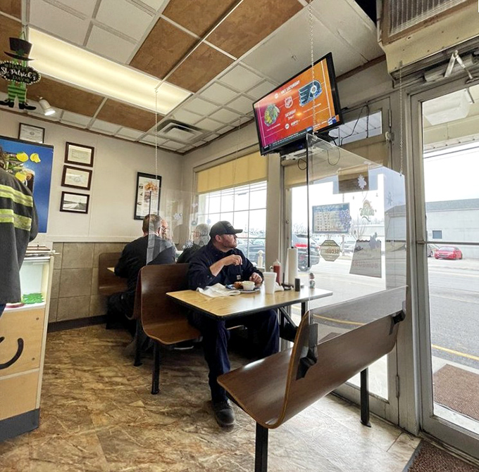 A moment of dining solitude that speaks volumes. In an age of Instagram meals, there's something profound about a man simply enjoying his food.