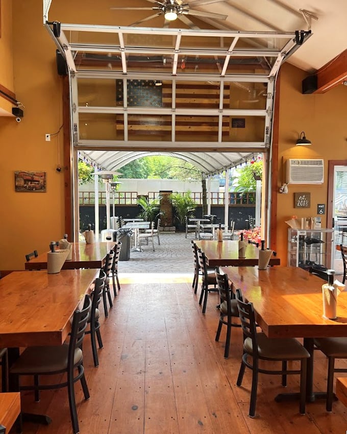 Wide plank floors and wooden tables create the perfect rustic stage for the smoky drama that's about to unfold on your plate.