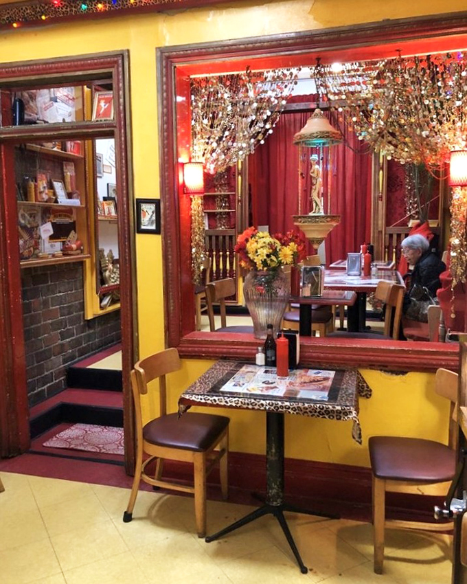 Yellow walls, red trim, and leopard print accents create a dining space that's as memorable as the food&mdash;like eating in a quirky friend's living room.