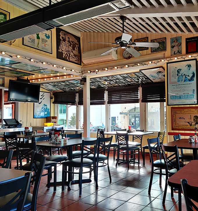 The dining area's vintage movie posters and memorabilia create an atmosphere where every meal feels like a scene from your favorite comfort film.