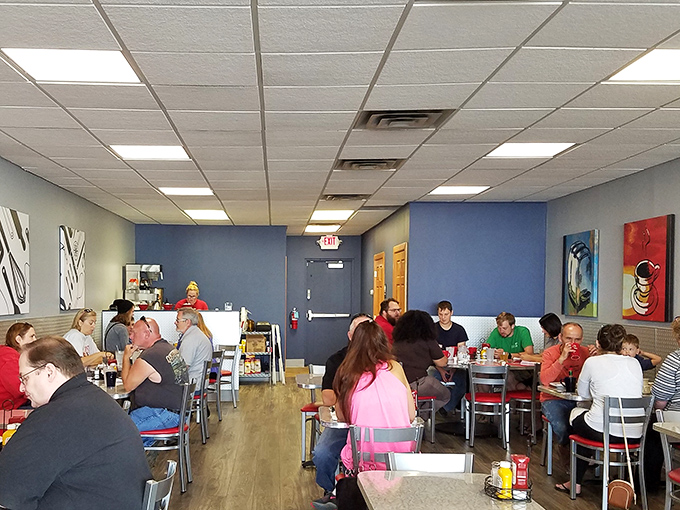 The bustling dining room where breakfast stories unfold and strangers become temporary neighbors united by the pursuit of perfect eggs.