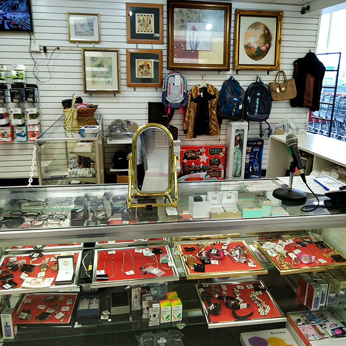 The jewelry counter: where someone's past sparkle becomes your future shine. Glass cases protecting treasures that won't break the bank.