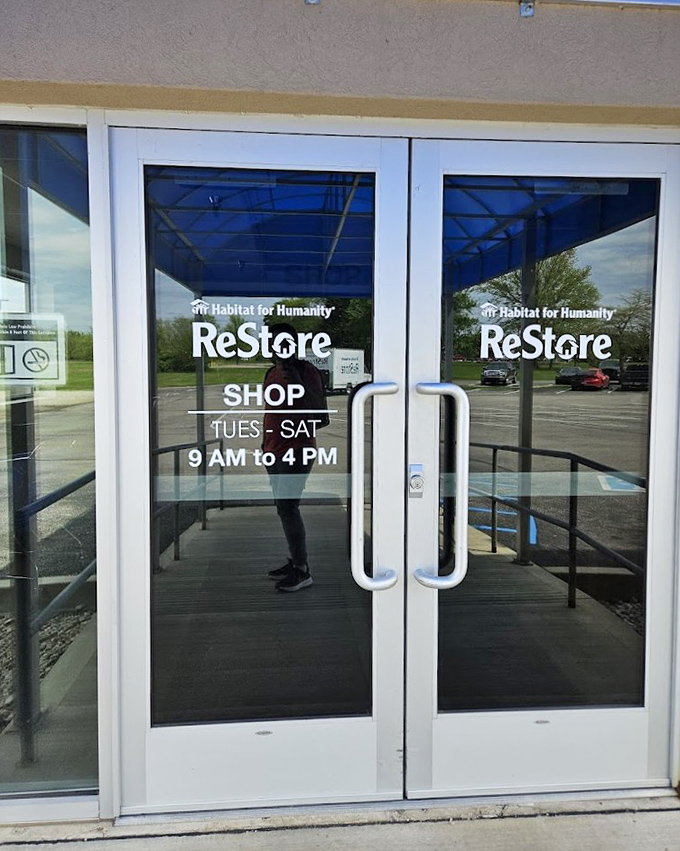 Business hours advertised on glass doors that serve as portals to a world where one person's discard becomes another's discovery.
