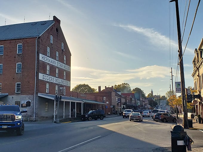 Golden hour bathes Hermann's main street in warm light, highlighting historic buildings and small-town charm. The perfect time to stroll through living history.