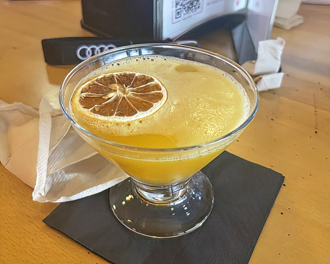 This citrus cocktail isn't just a drink; it's liquid sunshine with a dehydrated lemon slice that deserves its own Instagram account.